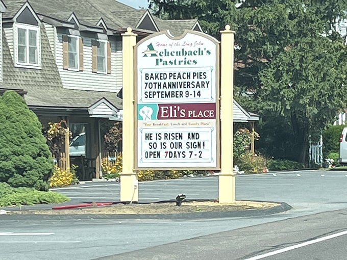 The roadside sign announces "70th Anniversary" and operating hours&mdash;a landmark that's been measuring life in pastries for generations.