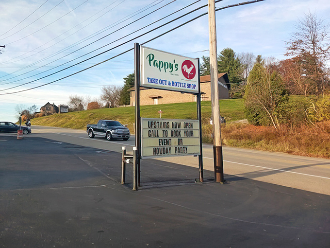 The roadside sign stands tall and proud, calling hungry travelers like a lighthouse guides ships to shore.