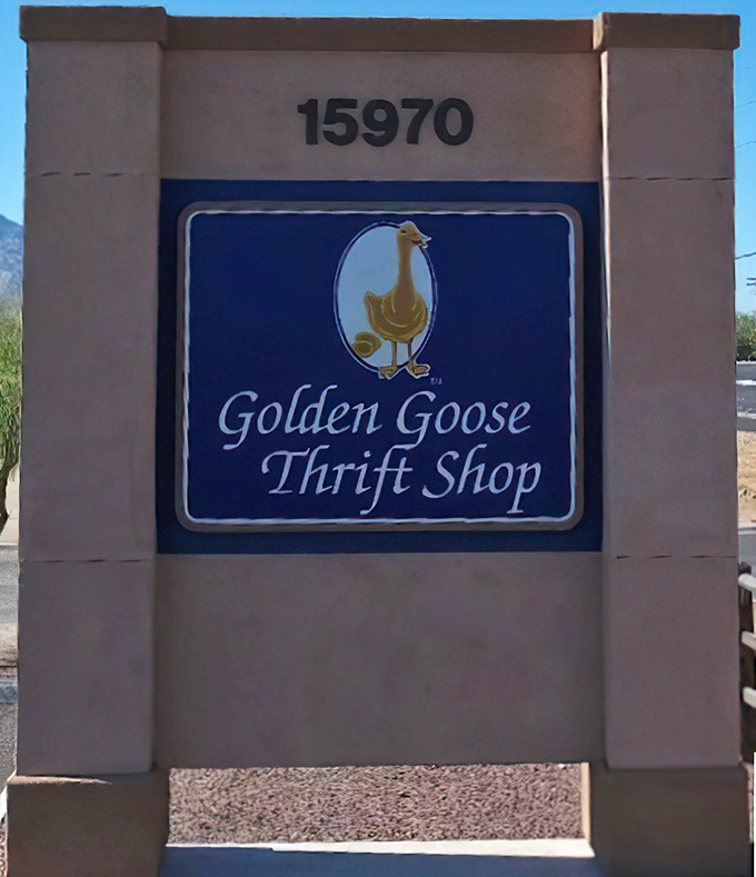 The Golden Goose sign stands sentinel at the roadside, its cheerful mascot promising golden opportunities for savvy shoppers.