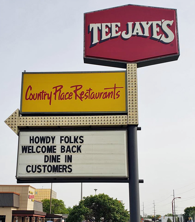 A sign that says "Howdy Folks" with the sincerity that only a place serving gravy by the ladle can truly deliver.