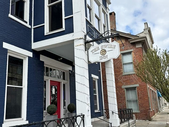 That red door and hanging sign say "Welcome" more eloquently than words. Like finding the entrance to a delicious secret society.