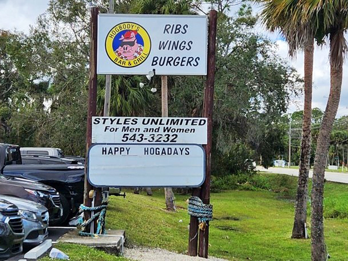 The roadside sign promises exactly what you'll get: ribs, wings, and burgers that make detours absolutely necessary.