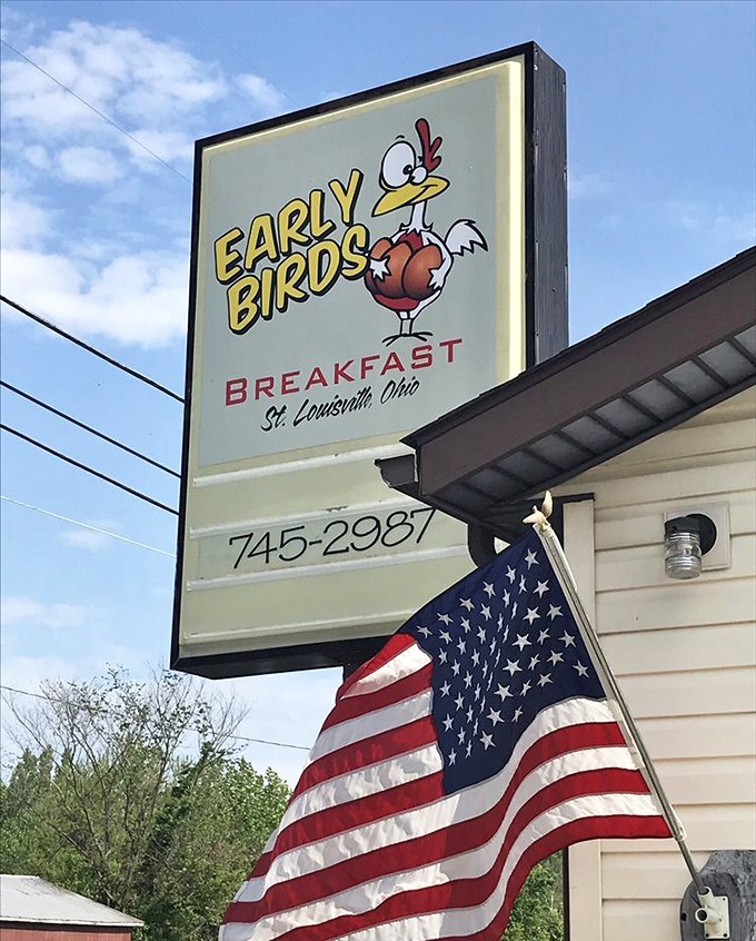 The iconic Early Birds sign and American flag&mdash;a perfect pairing that says "heartland breakfast" more eloquently than any food writer ever could.