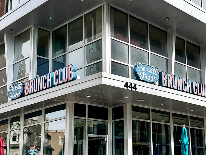 The neon promise of "BRUNCH CLUB" glows like a beacon for the breakfast-obsessed. Membership requires only an appetite and appreciation for morning masterpieces.