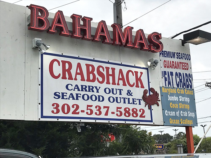 This sign isn't just advertising&mdash;it's a lighthouse for hungry travelers. "Premium Seafood Guaranteed" isn't just a slogan; it's a solemn promise to your taste buds.