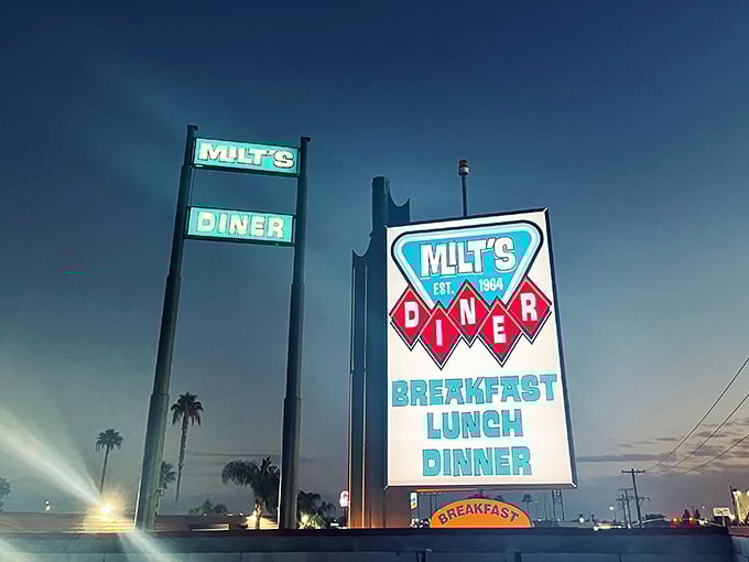 As twilight falls, Milt's neon sign glows like a lighthouse, guiding hungry souls to comfort food salvation.