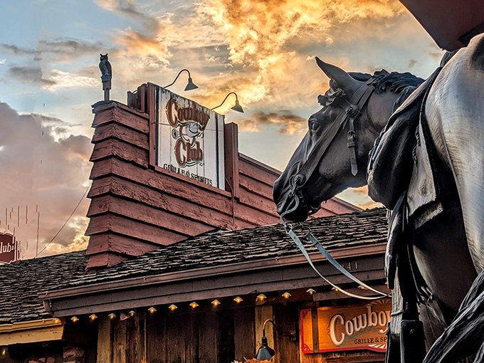 A horse statue stands guard at sunset, reminding everyone this is where the Wild West meets fine dining.