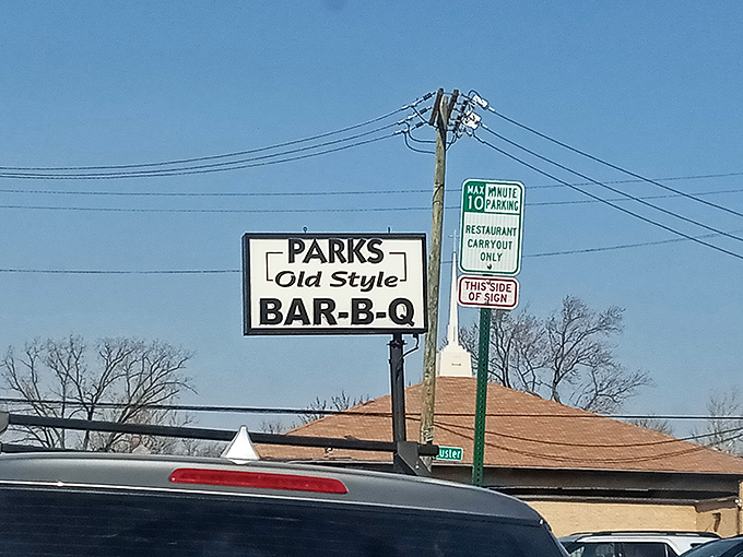 The roadside sign stands as a beacon of hope for the hungry traveler. Like a lighthouse, but guiding you to ribs instead of safe harbor.