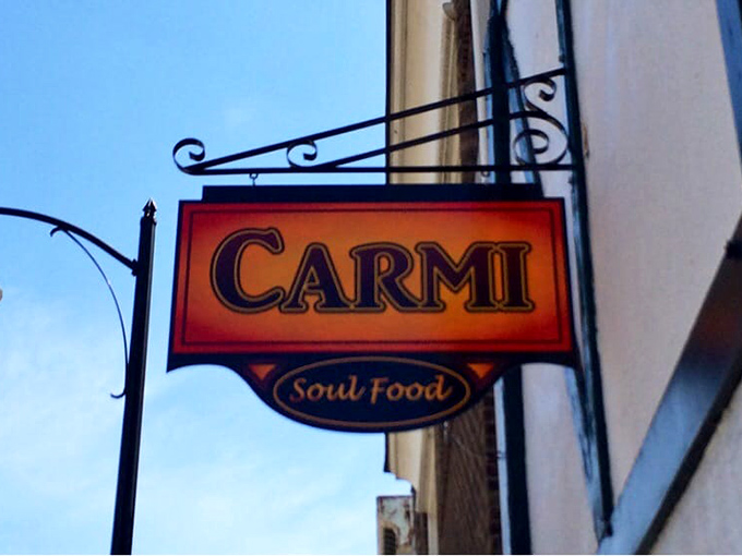 This sign doesn't just mark a restaurant; it's a beacon for hungry souls seeking authentic Southern comfort in the heart of Pittsburgh.