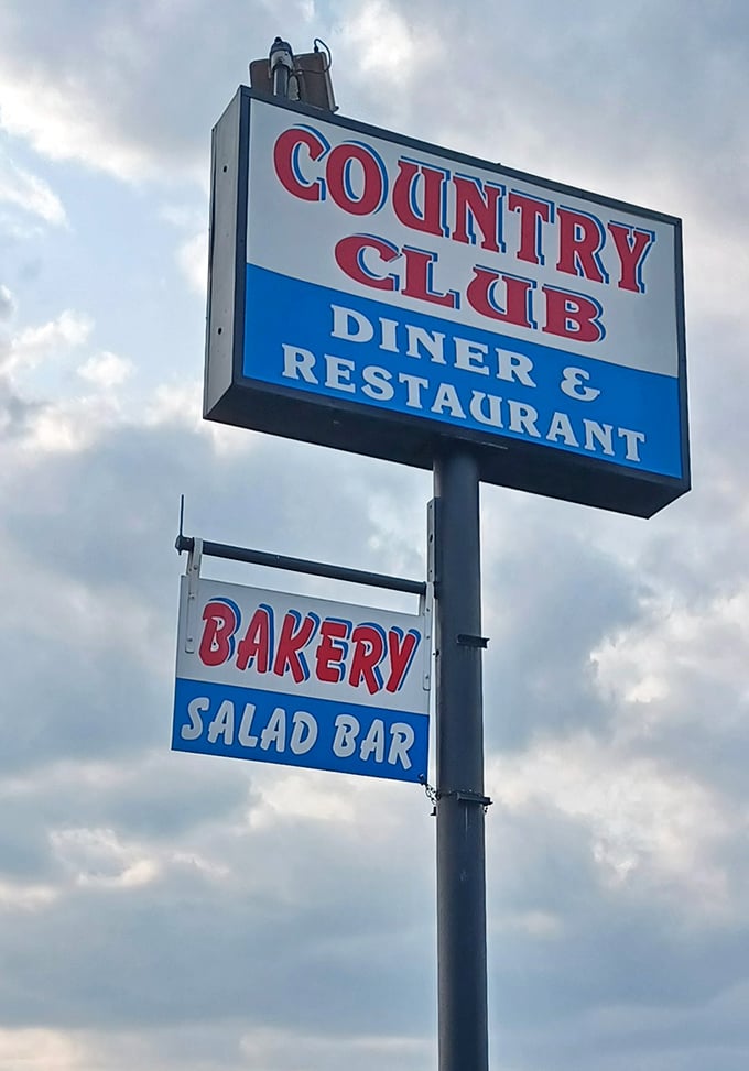 The roadside sign proudly announces not just a diner, but a complete experience&mdash;bakery and salad bar included&mdash;under one welcoming roof.