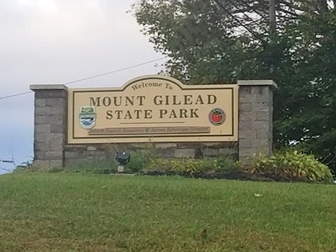 The gateway to tranquility. This unassuming entrance sign promises little but delivers everything your nature-starved soul needs.