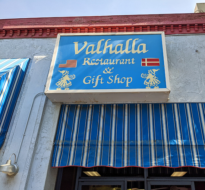 The vintage blue and white awning beneath the Valhalla sign features both American and Danish flags – a perfect symbol of this culinary cultural marriage.