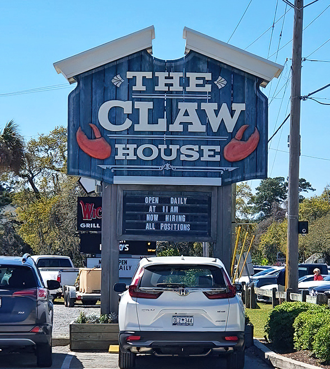 The roadside sign announces your arrival at lobster paradise. Those red claws are practically waving you in.