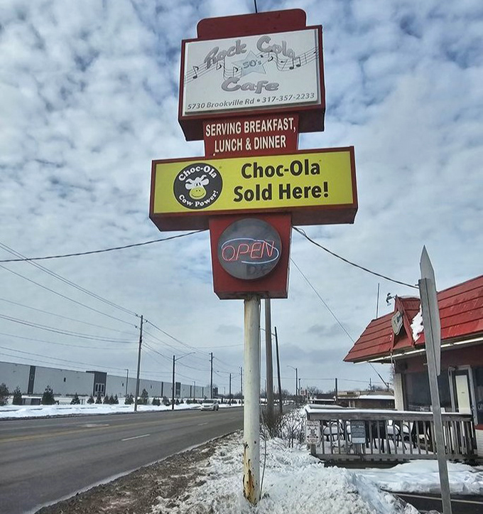 That sign isn't just announcing a restaurant—it's a landmark, a beacon calling to those who remember when Choc-Ola was the chocolate drink of choice.