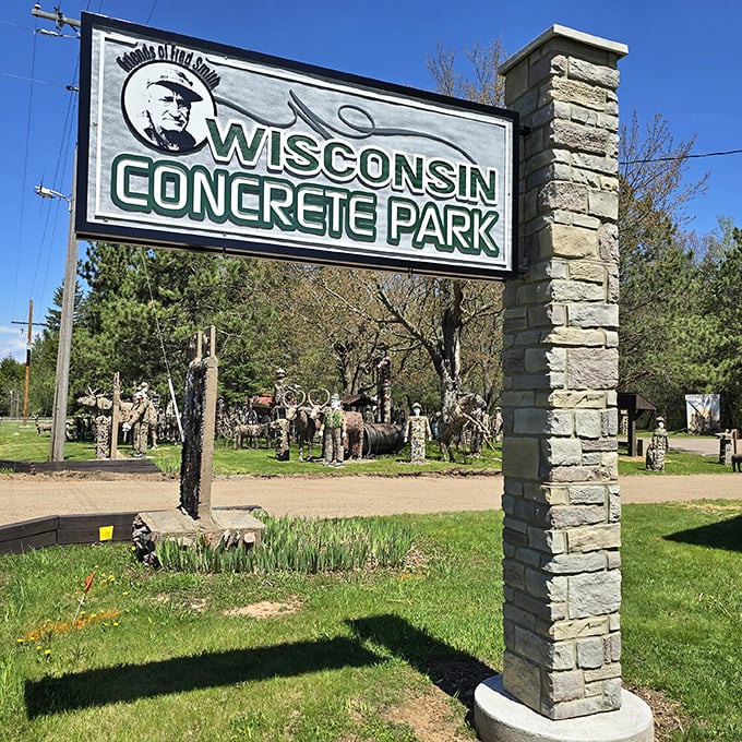 The entrance sign promises concrete delights beyond—like a theme park where the theme is "What if everything was made of concrete and bottles?"