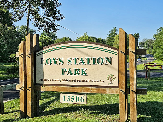 The sign promises adventure beyond &ndash; Loys Station Park delivers both recreation and a journey through Maryland's transportation history.