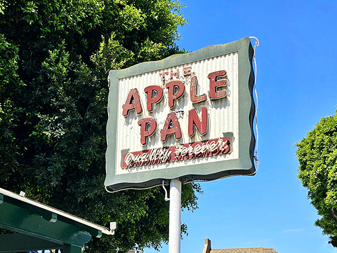 The weathered roadside sign has guided hungry Angelenos for decades—a beacon of culinary consistency in a city obsessed with the next big thing.