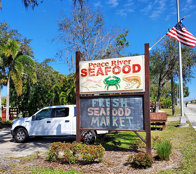 The roadside sign promises exactly what you'll get&mdash;fresh seafood that makes the detour worthwhile. No false advertising here.