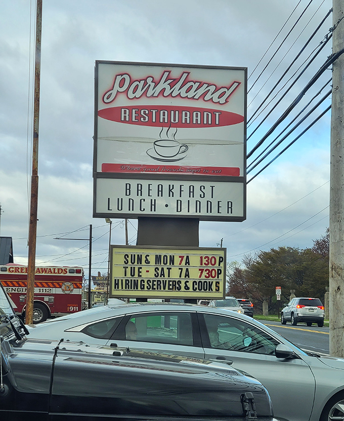 The roadside sign promises the trifecta of essential meals. In diner language, "Breakfast Lunch Dinner" translates to "We've got you covered, hungry human."