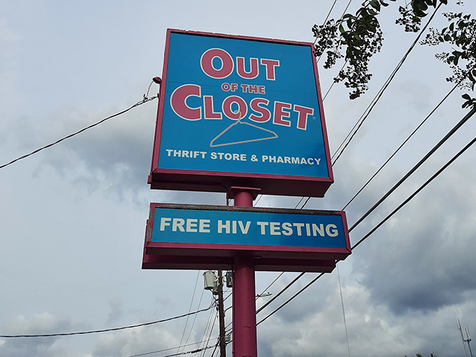 The roadside sign stands tall, announcing both bargains and free health services – a combination as unexpected as it is essential.