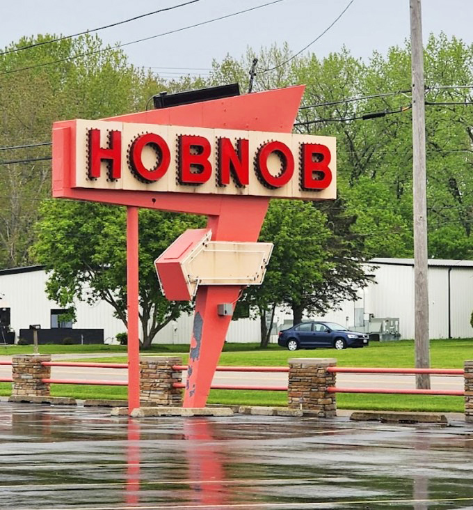 The roadside sign stands proud against Wisconsin skies &ndash; a landmark that's guided hungry travelers to exceptional meals for decades.