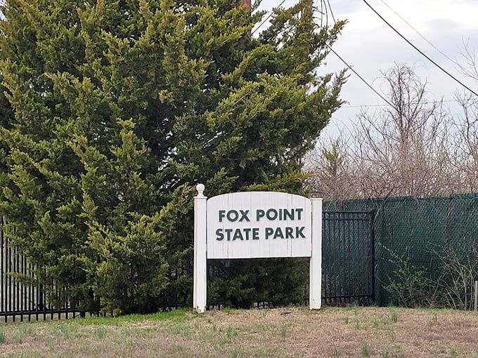 No fancy entrance needed when what lies beyond speaks for itself. Fox Point State Park: where simplicity announces extraordinary experiences.