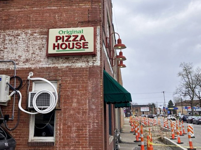 No fancy marketing needed &ndash; just a straightforward sign promising "Original Italian Style Pizza" that delivers precisely what it advertises.