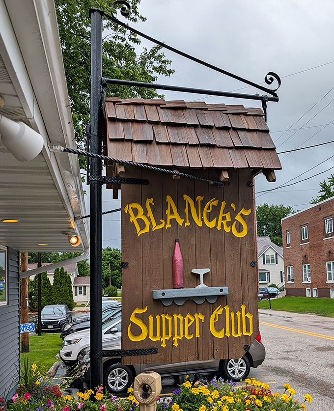 The iconic wooden sign that beckons hungry travelers like a lighthouse for the famished. Follow it to lobster happiness.