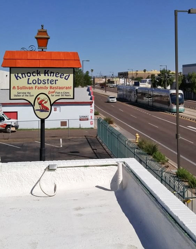 The roadside sign stands proud against the Arizona sky, a beacon for seafood lovers navigating the urban desert.