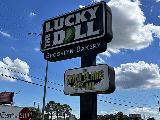 The Lucky Dill sign stands tall against Florida clouds, a beacon of hope for the sandwich-deprived masses seeking New York-style salvation.