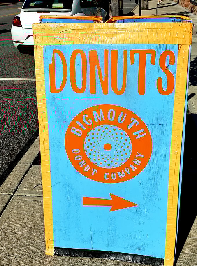 This cheerful sidewalk sign points the way to happiness with the subtlety of a sugar rush&mdash;bold, bright, and impossible to ignore.