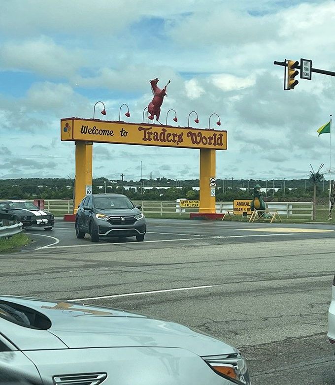 The grand entrance arch announces your arrival at Traders World, where that leaping red horse seems to say "abandon all shopping lists, ye who enter here."