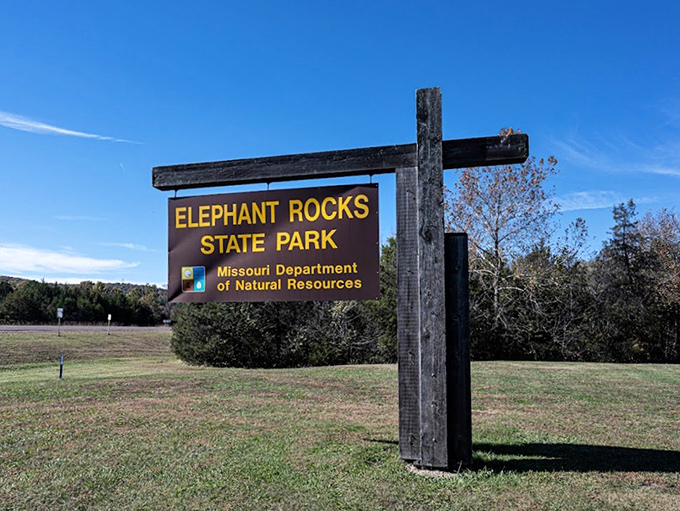 The unassuming entrance sign offers no hint of the prehistoric wonderland waiting just beyond, like finding Narnia in your own backyard.