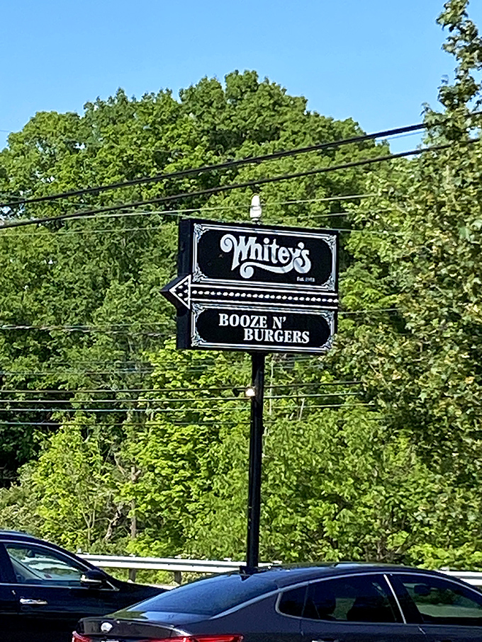 The roadside sign stands tall against Ohio greenery, a beacon guiding hungry travelers to their burger destiny.