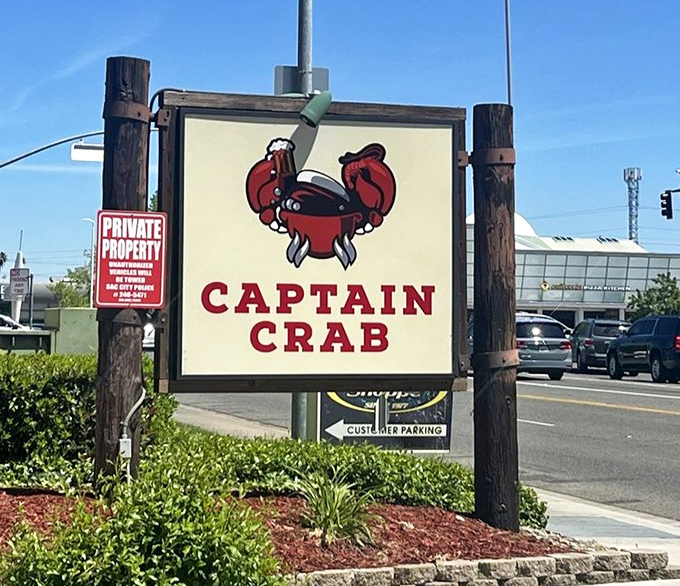 The roadside sign serves as a beacon for seafood lovers. Like a lighthouse guiding hungry sailors home, it promises safe harbor for empty stomachs.