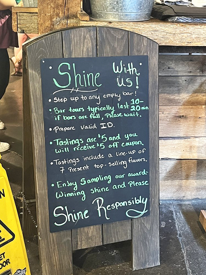 The moonshine manifesto! This charming chalkboard outlines the tasting experience, proving that even outlaw spirits eventually develop civilized manners.