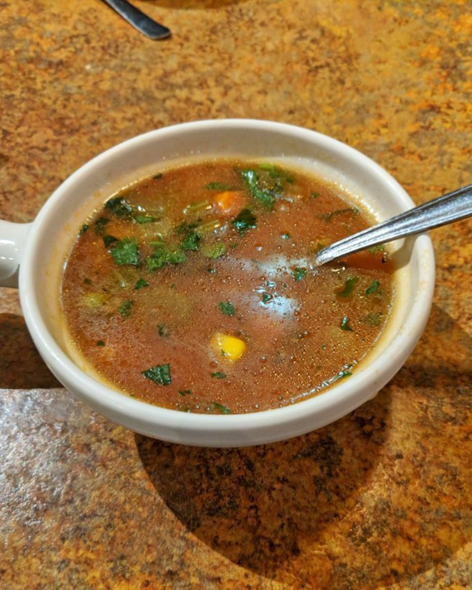 This humble cup of soup contains more depth and character than most Hollywood blockbusters, with cilantro playing the scene-stealing supporting role.