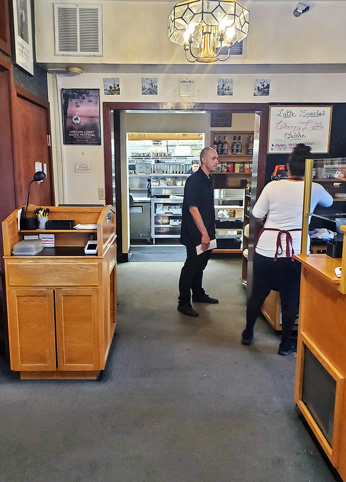 The kitchen pass&mdash;where breakfast magic happens. Those aprons have seen more perfect eggs than most people will in a lifetime.