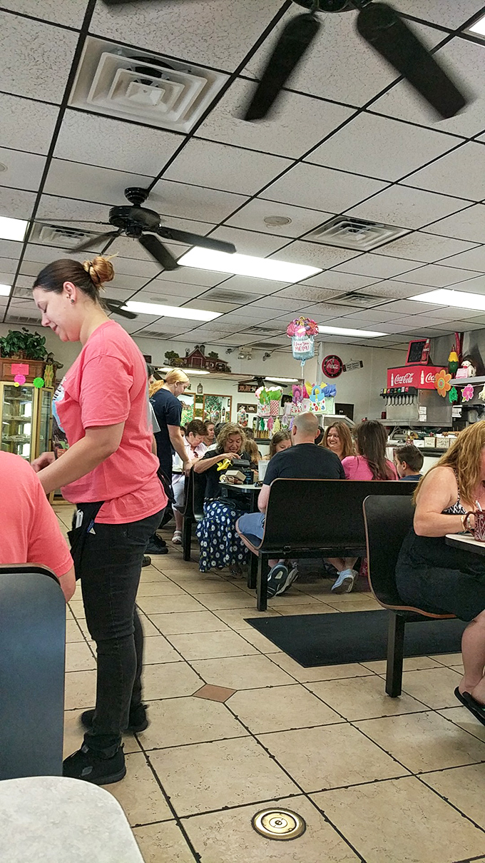 The staff moves with the choreographed precision of people who know exactly what makes a perfect diner experience.