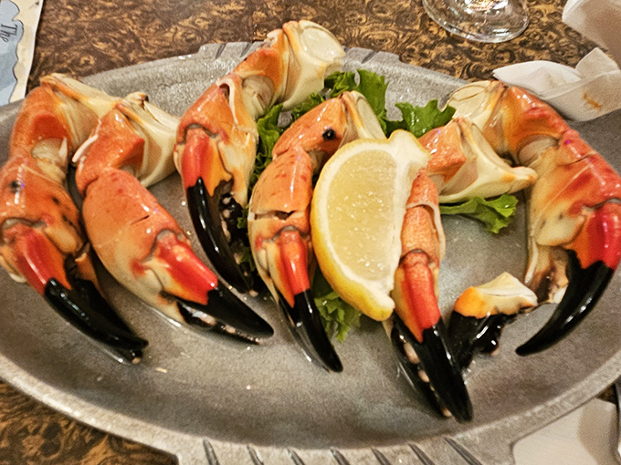 Stone crab claws arranged like a seafood crown, served with a lemon wedge scepter. Florida royalty on a plate.