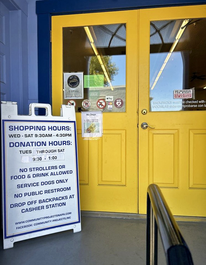 The cheerful yellow doors and clear shopping hours set expectations. Wednesday through Saturday, treasure hunting commences at 9.