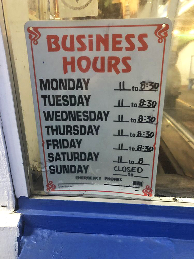 Old-school business hours sign reminds us that sometimes the best places don't need to be open 24/7 to be worth planning your schedule around.