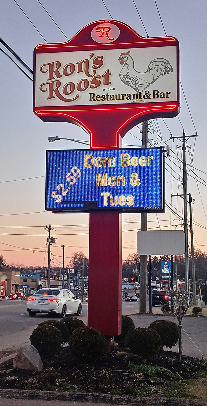 The roadside sign stands tall against the twilight sky, a neon promise of culinary delight that's been fulfilled since 1960.