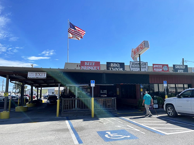 An American flag waves proudly above Johnson Barbeque, as if to say, "This, my friends, is what makes America delicious."