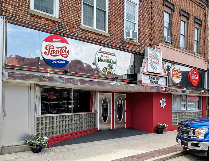 The storefront proudly displays vintage soda signs like badges of honor. This isn't just a restaurant&mdash;it's a preservation society for American food culture.