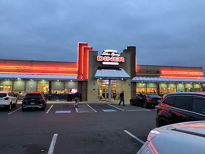 As evening falls, Silver Spring Diner glows like a lighthouse for the hungry, its neon promising safe harbor from cooking your own dinner.