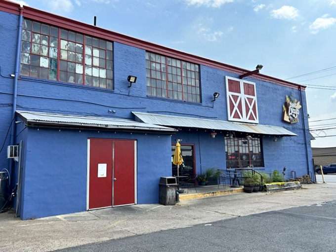 The blue exterior with red trim stands like a beacon of BBQ hope in an industrial area &ndash; worth the journey every single time.
