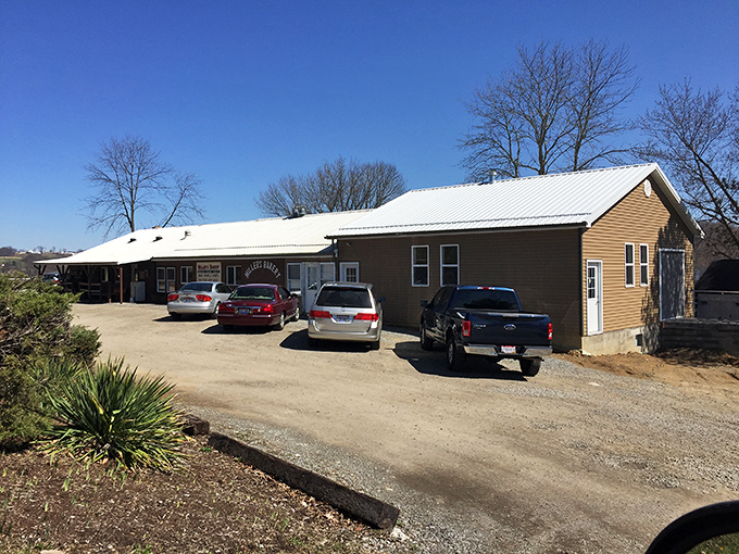 The side view reveals cars parked with purpose. These aren't casual visitors&mdash;these are people on a mission for Miller's magnificent creations.