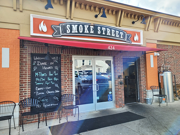 The entrance that launches a thousand cravings. The chalkboard menu and welcoming doorway are the first hints that your barbecue pilgrimage will be richly rewarded.