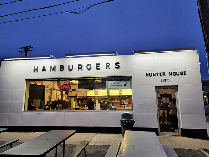 As dusk falls, the illuminated Hunter House beckons like a white beacon of burger bliss&mdash;a midnight mirage for the hungry night owls of Birmingham.